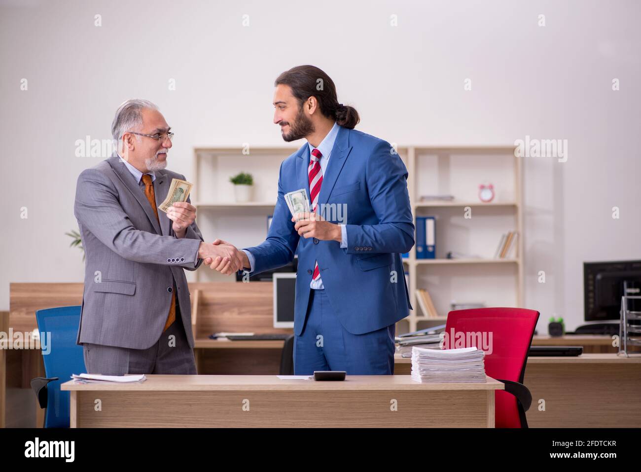 Giving salary to employees hi-res stock photography and images - Alamy