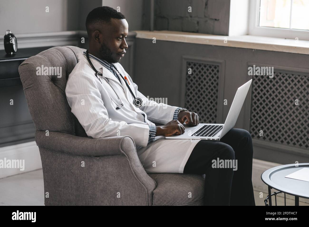 Medical consultation young professional afro hi-res stock photography ...