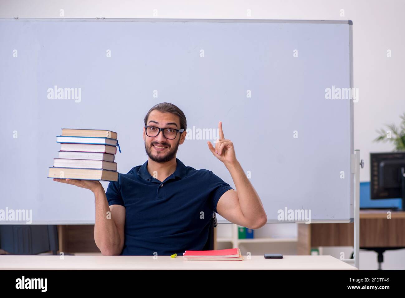 Young handicapped student in the classroom Stock Photo - Alamy