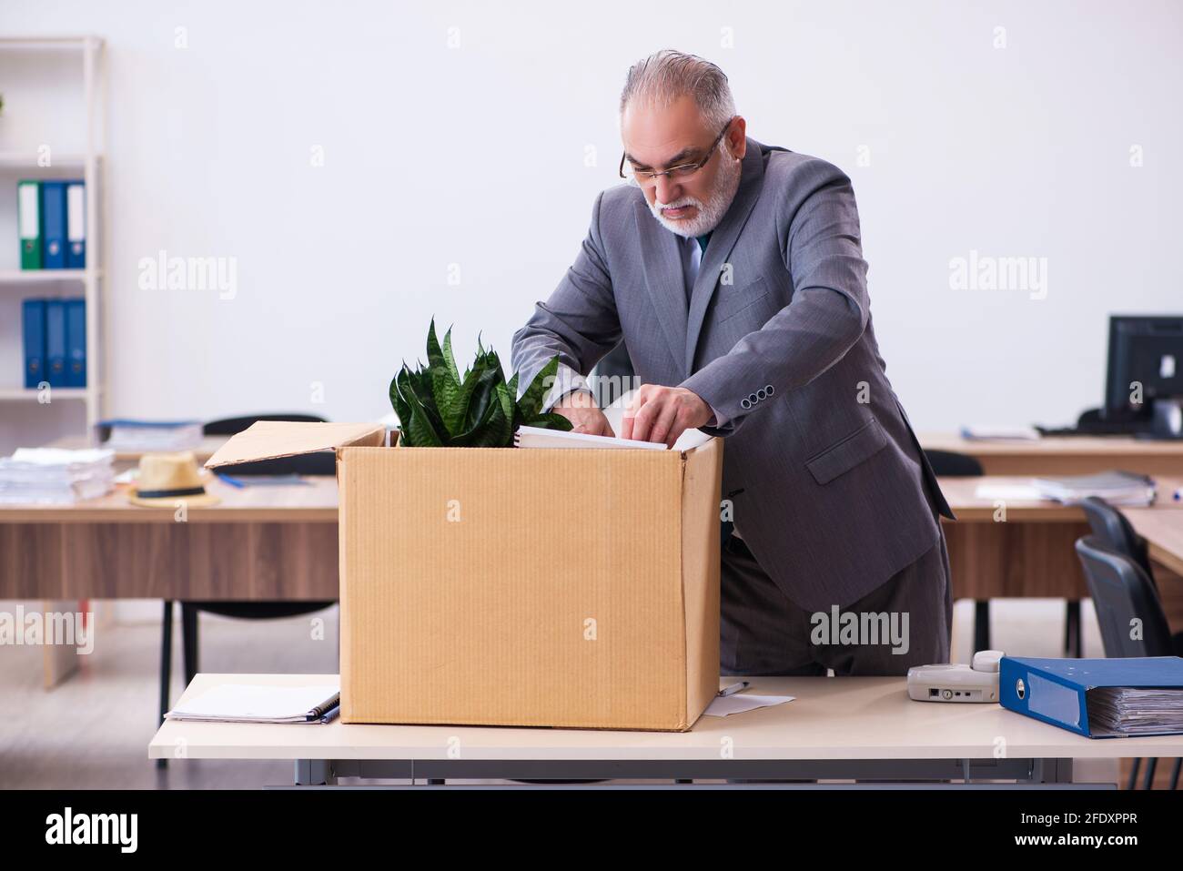 Old employee being fired from his work Stock Photo - Alamy