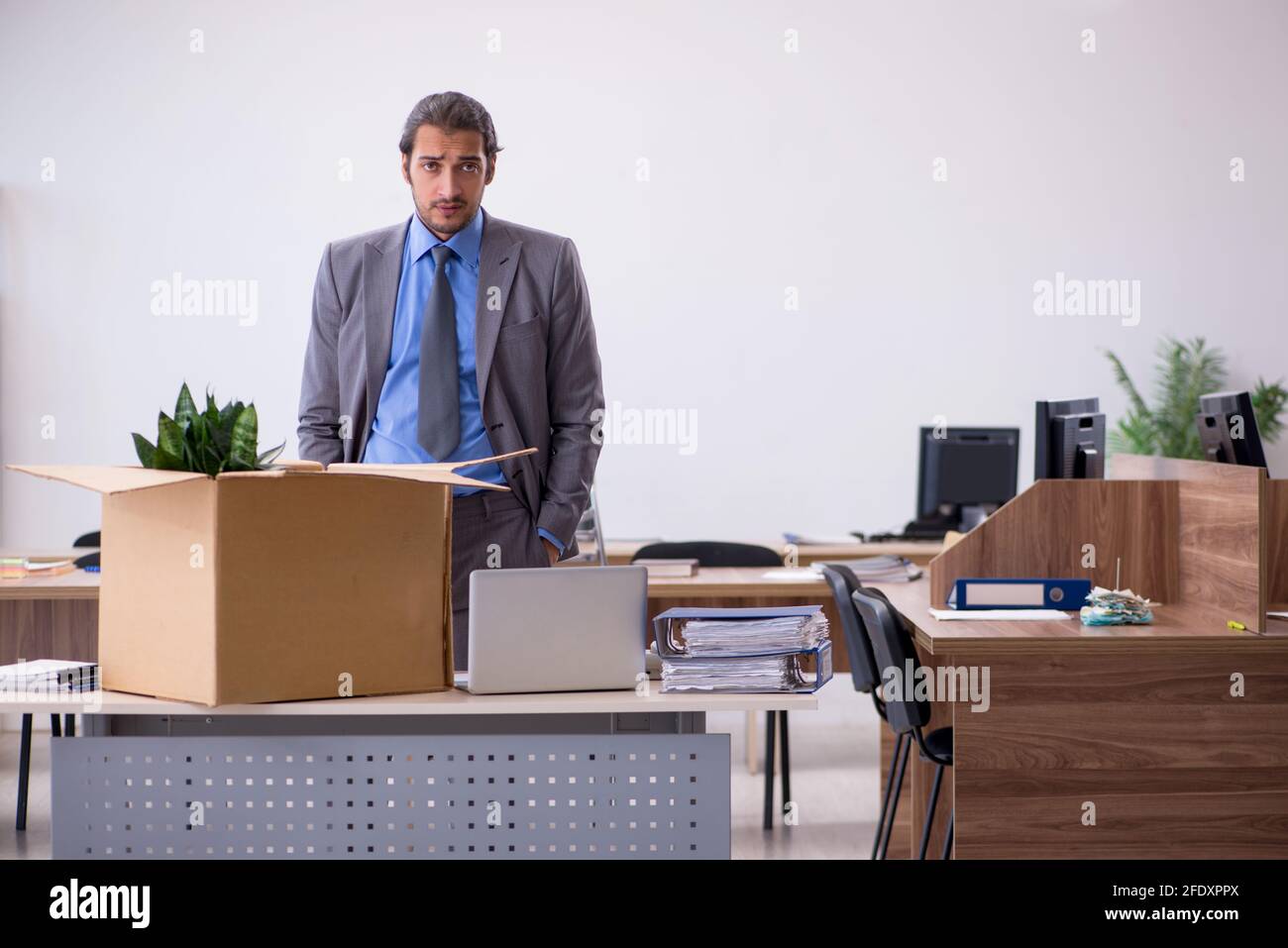 Young employee being fired from his work Stock Photo - Alamy
