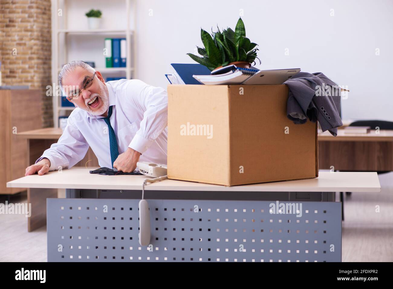 Old employee being fired from his work Stock Photo - Alamy