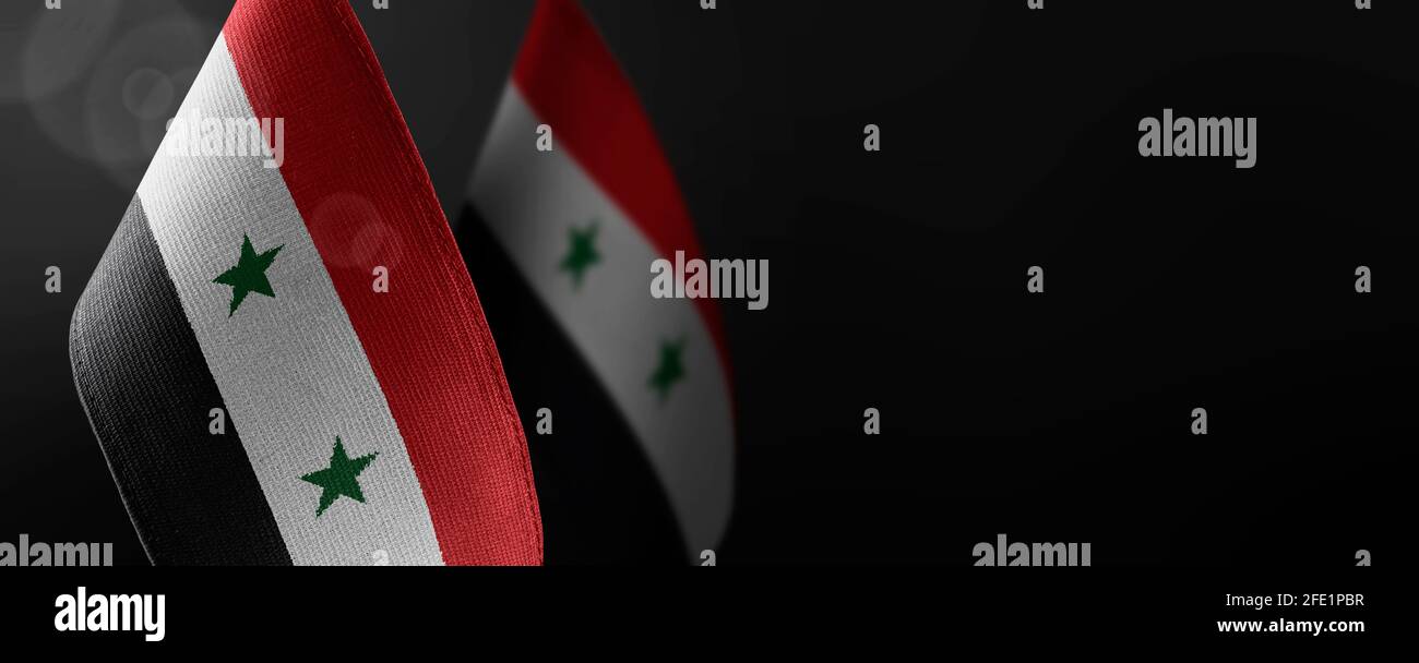 Small national flags of the Syria on a dark background Stock Photo - Alamy