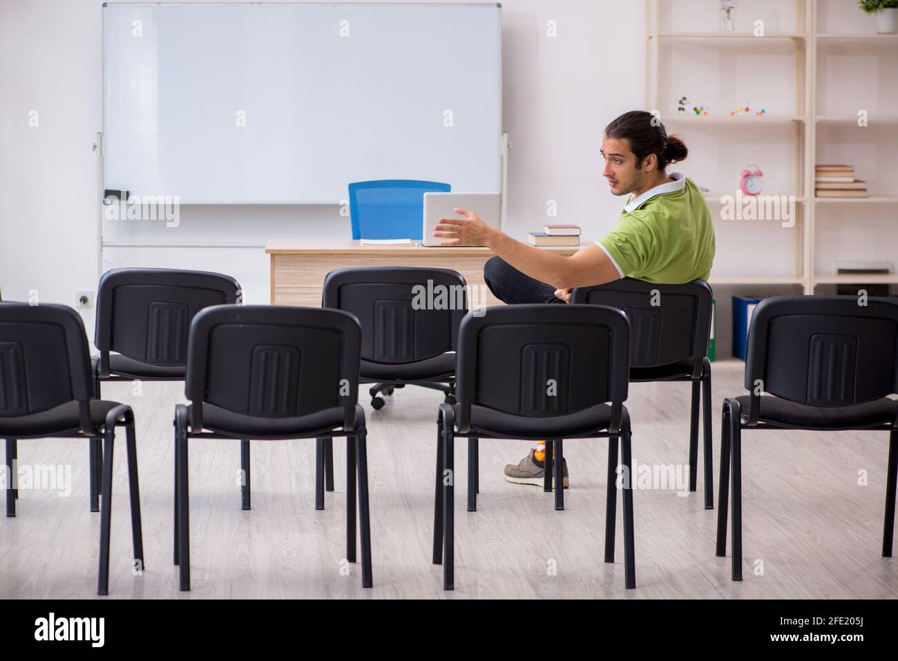 Young student in business presentation concept Stock Photo - Alamy