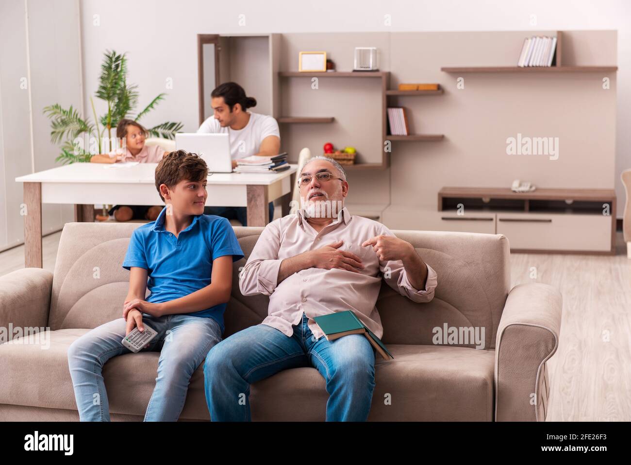Three generations at home in early development concept Stock Photo - Alamy