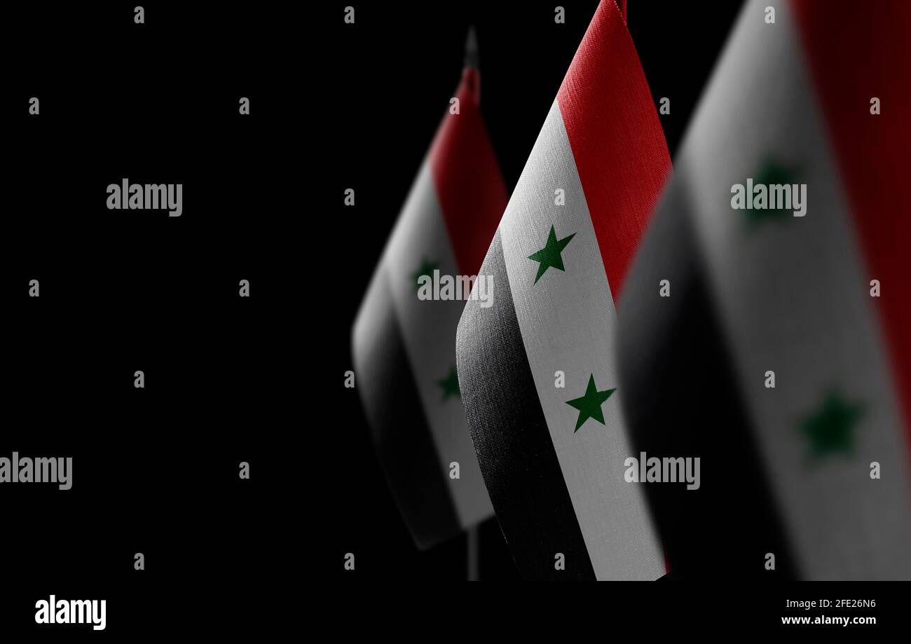 Small national flags of the Syria on a black background Stock Photo - Alamy