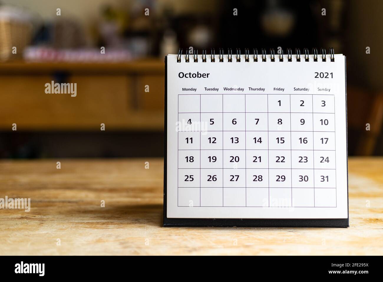 October 2021 calendar - month page showing date on wooden table Stock ...