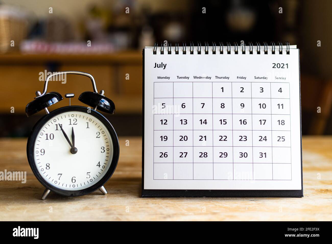 July 2021 calendar - month page showing date and vintage clock on ...