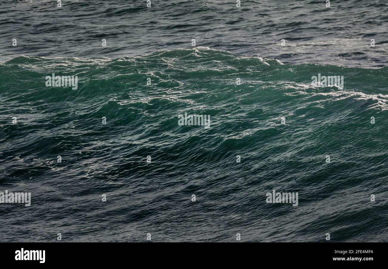A glassy wave about to crash Stock Photo - Alamy