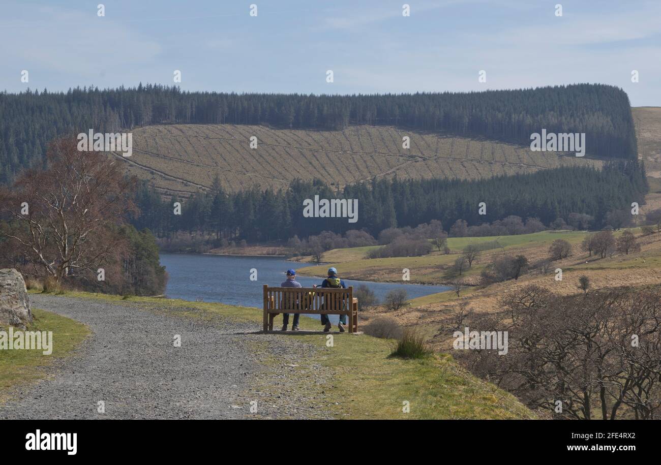 Visitors walking along the Elan valley trail with Victorian era ...
