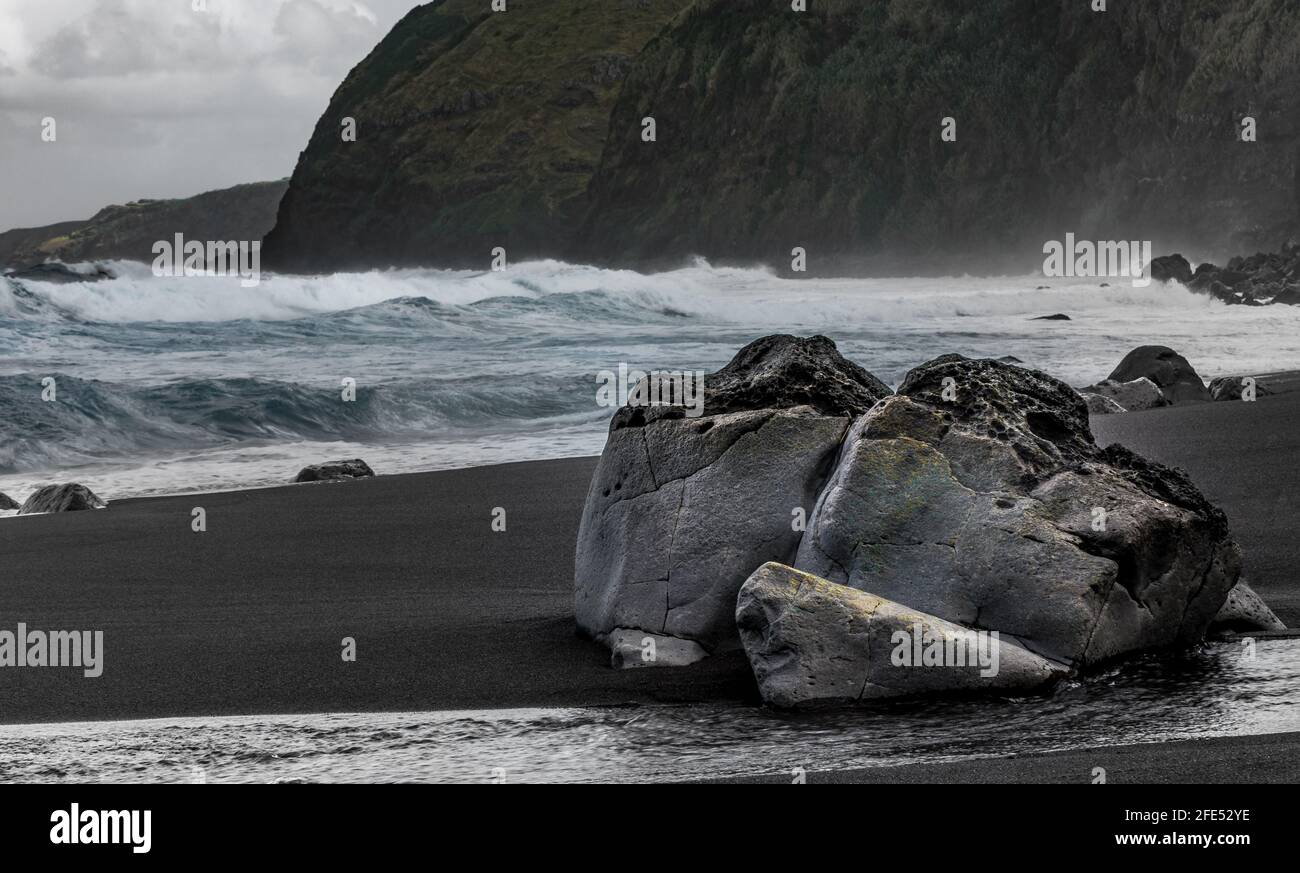 Black sand beach with black rock and strong waves, Sao Miguel, Azores ...