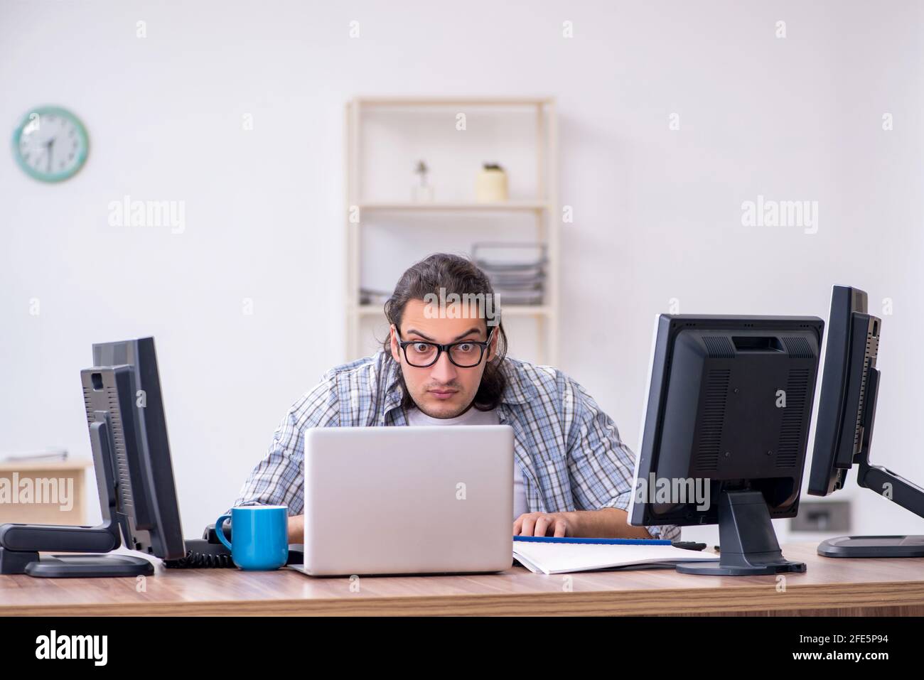 Male it specialist working in the office Stock Photo - Alamy