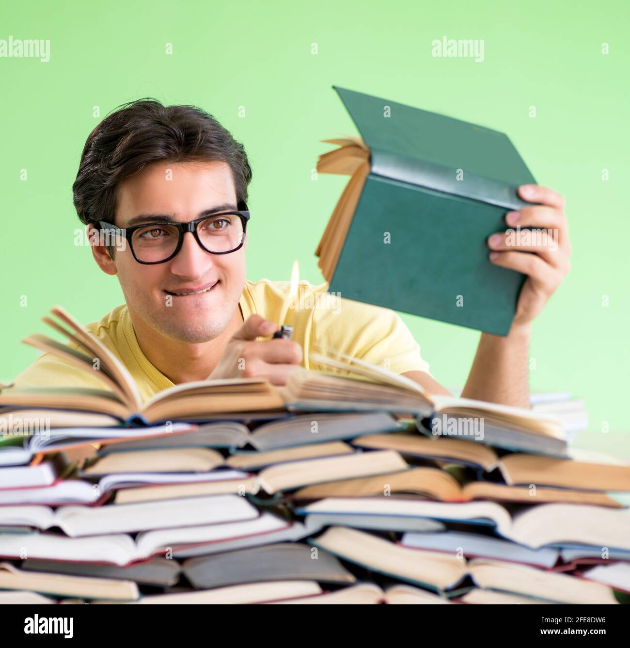The student with too many books to read before exam Stock Photo - Alamy