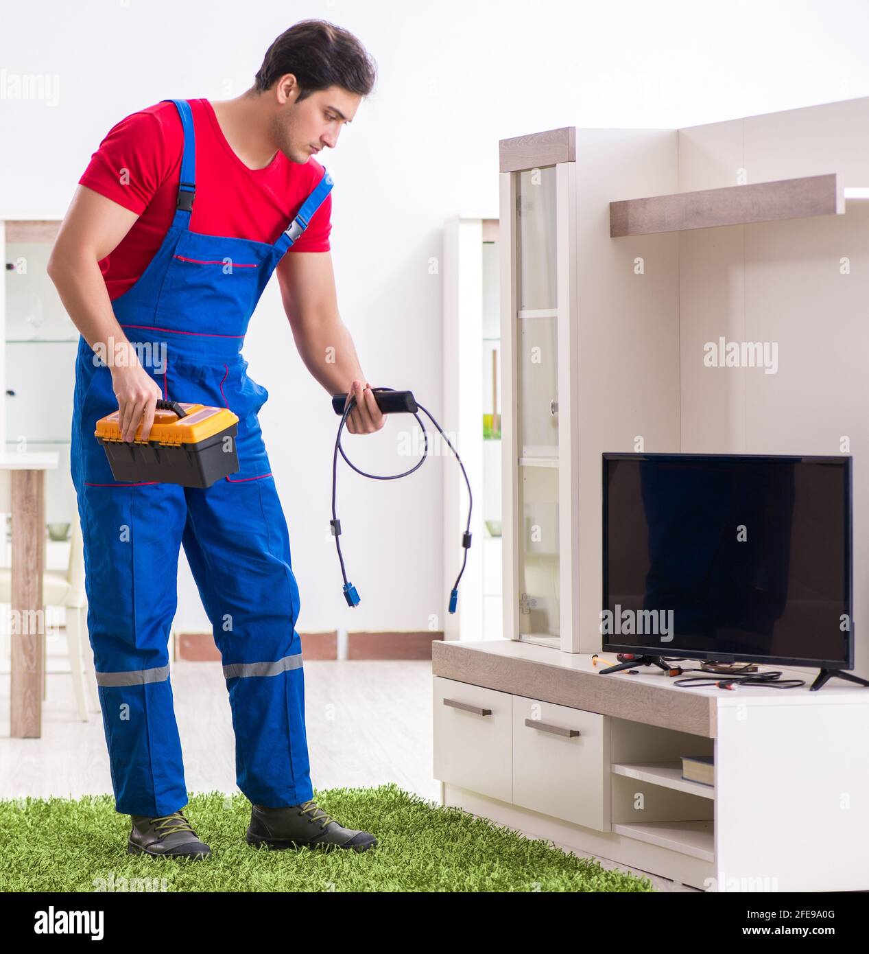 The professional repair engineer repairing broken tv Stock Photo - Alamy