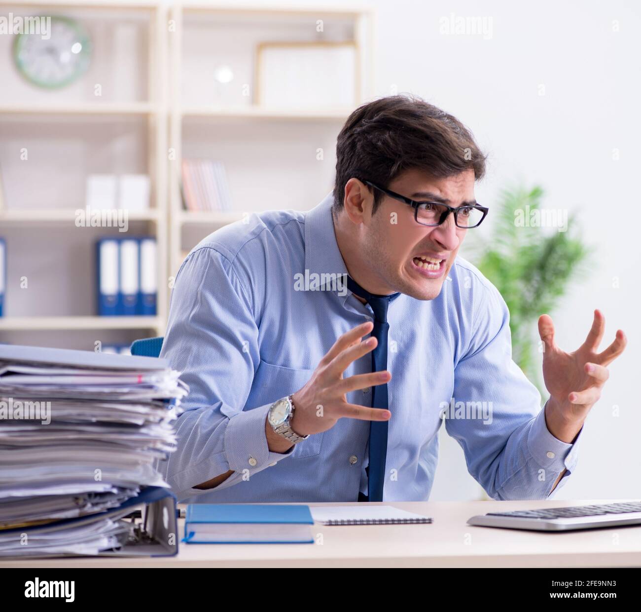 The tired businessman with too much paperwork Stock Photo - Alamy