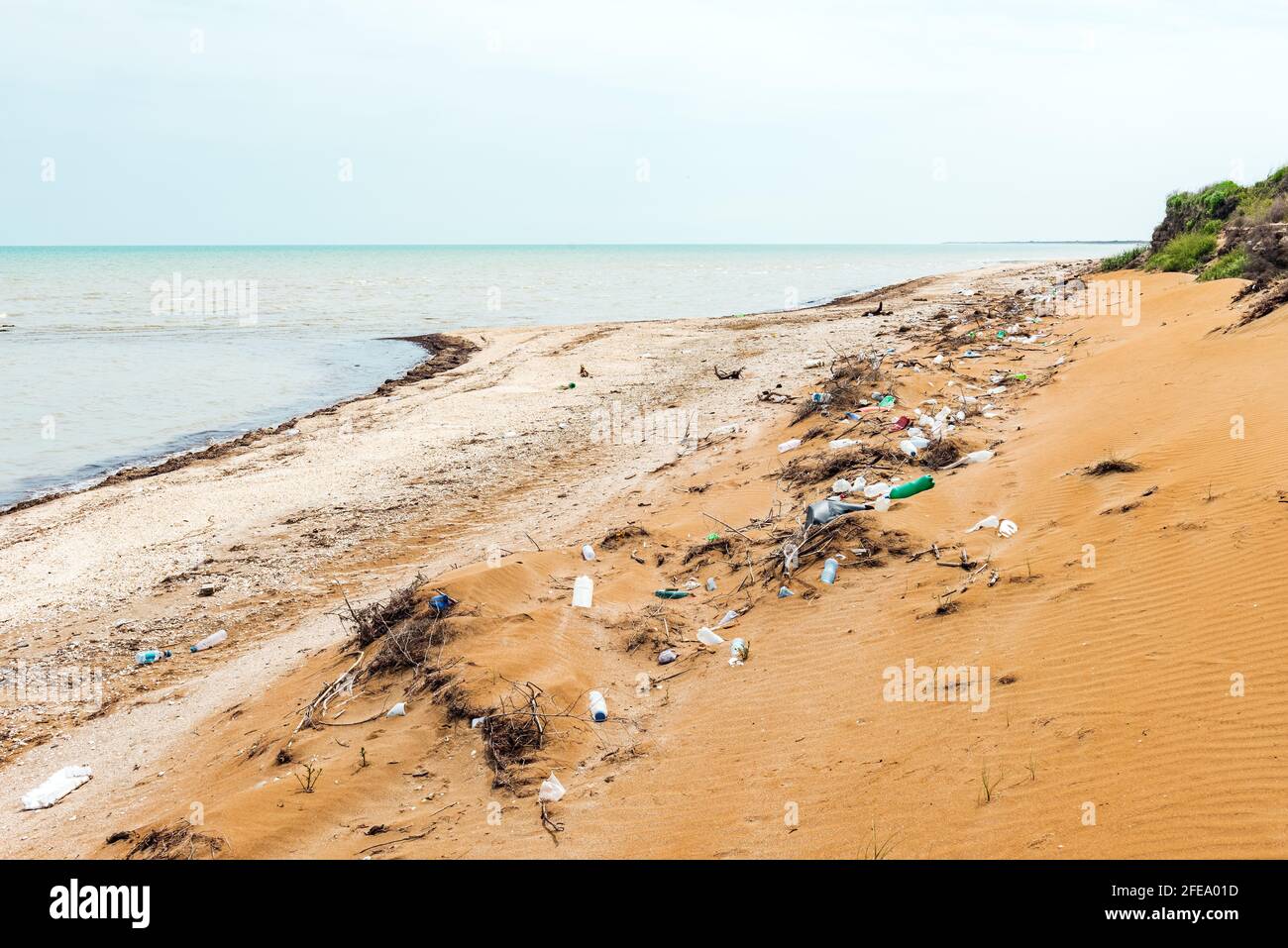 Seashore pollution with plastic bottles. Ecological problem Stock Photo ...