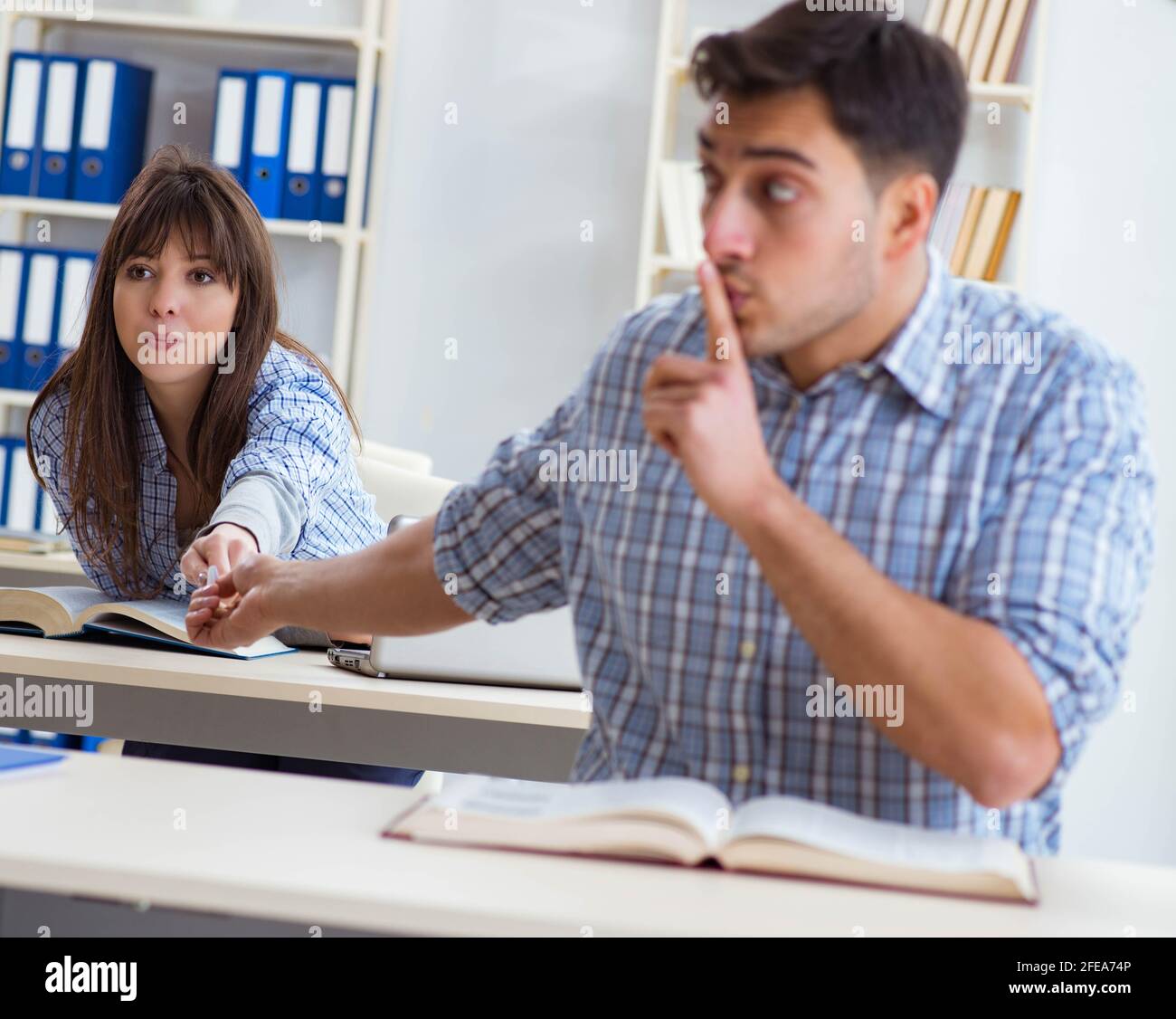 The students sitting and studying in classroom college Stock Photo - Alamy