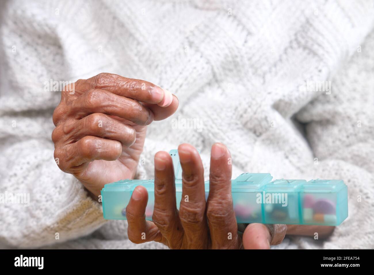 senior women hands taking medicine from a pill box Stock Photo - Alamy