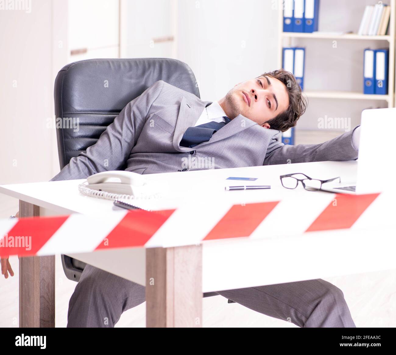 The dead businessman at this desk Stock Photo - Alamy