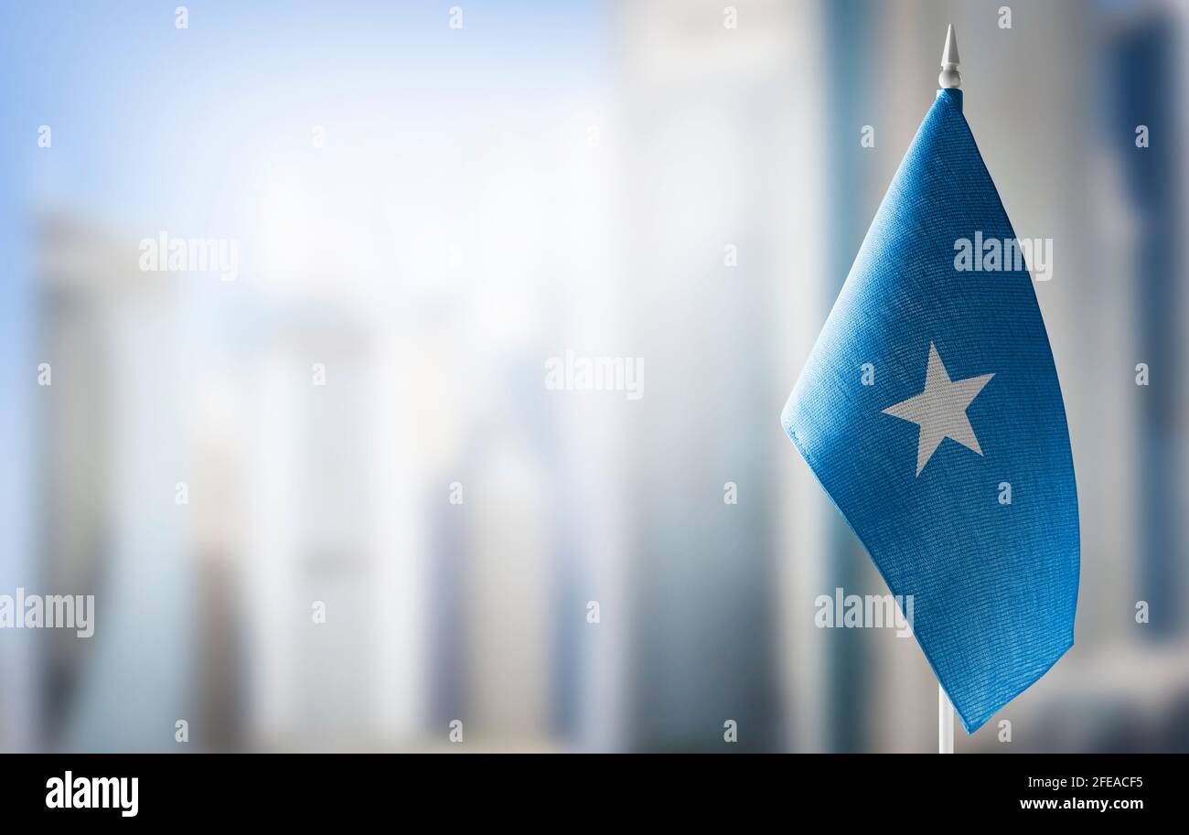 A small flag of Somalia on the background of a blurred background Stock ...