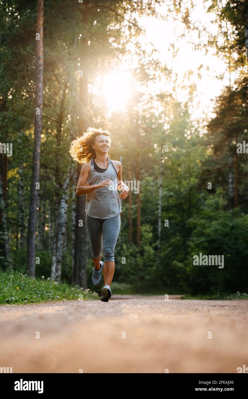 Female happy jogging hi-res stock photography and images - Alamy