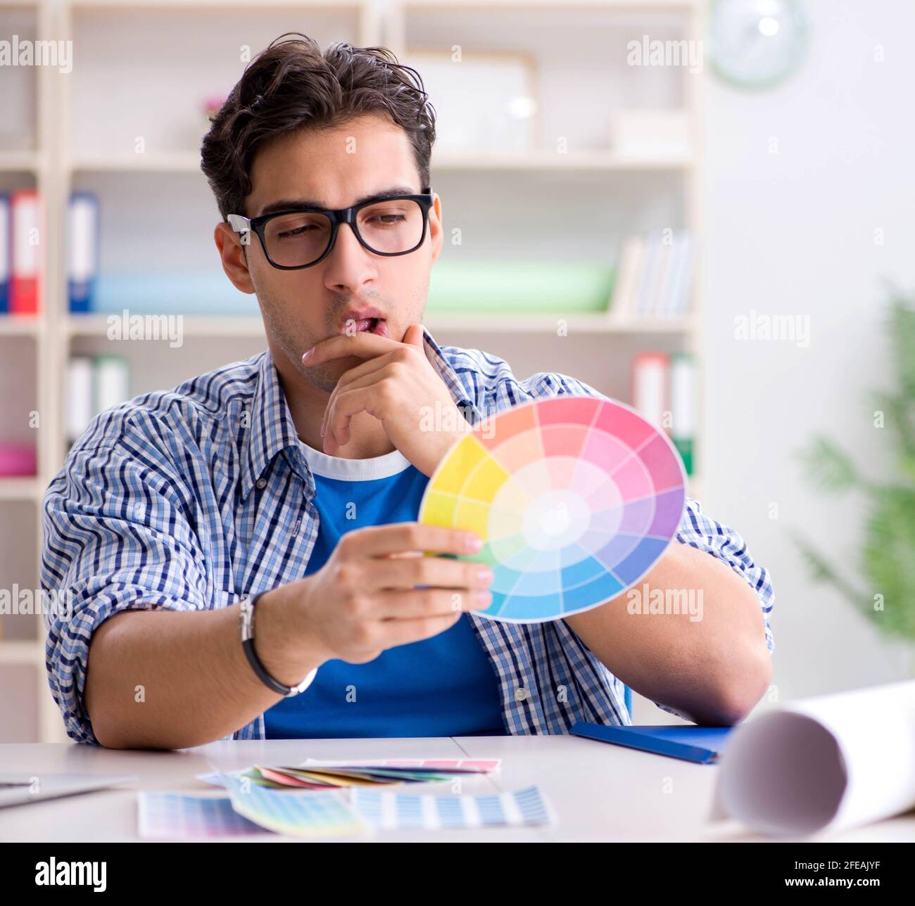 The young designer working on new project and choosing colours Stock ...
