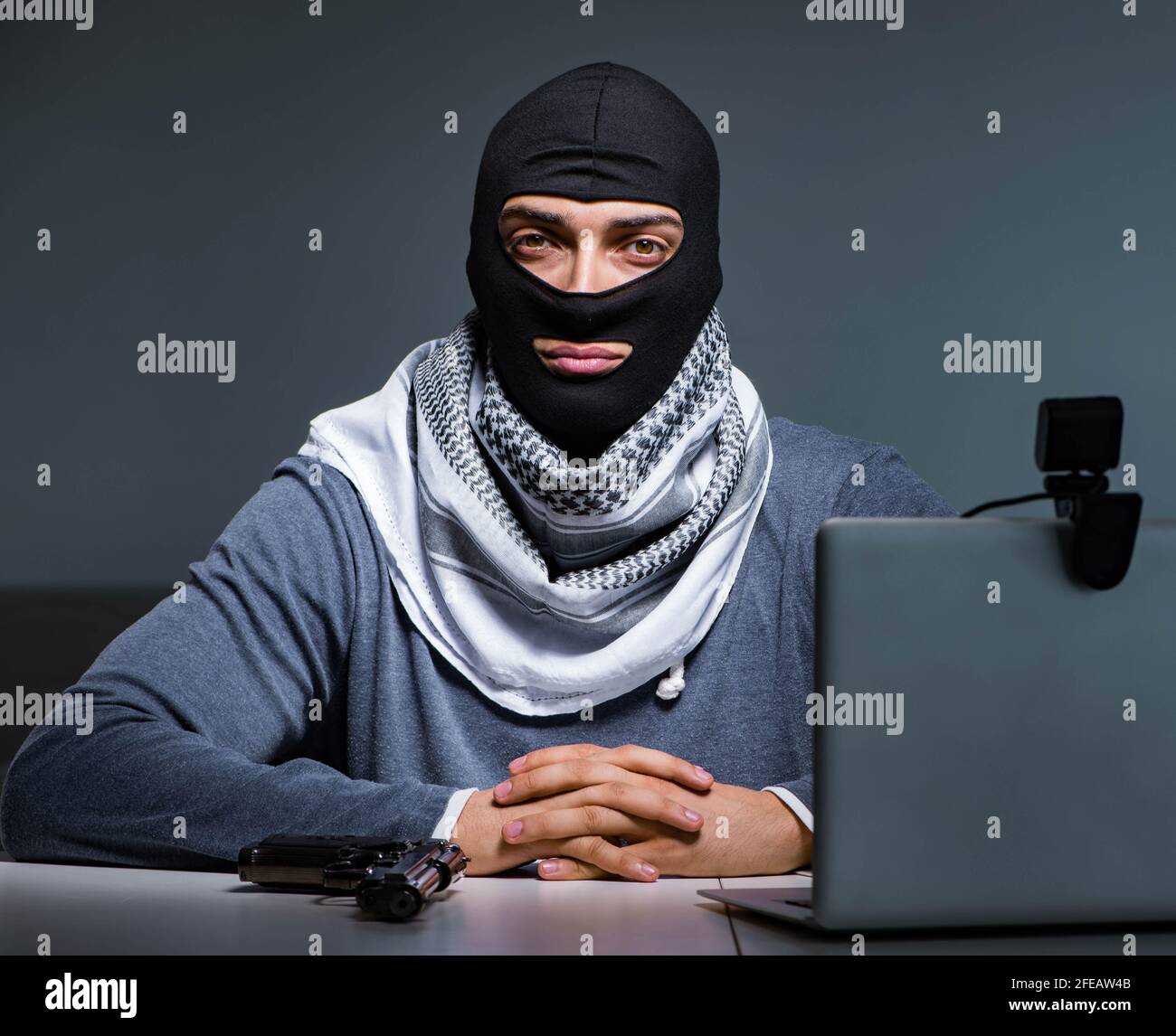 The hacker wearing balaclava mask hacking computer Stock Photo - Alamy