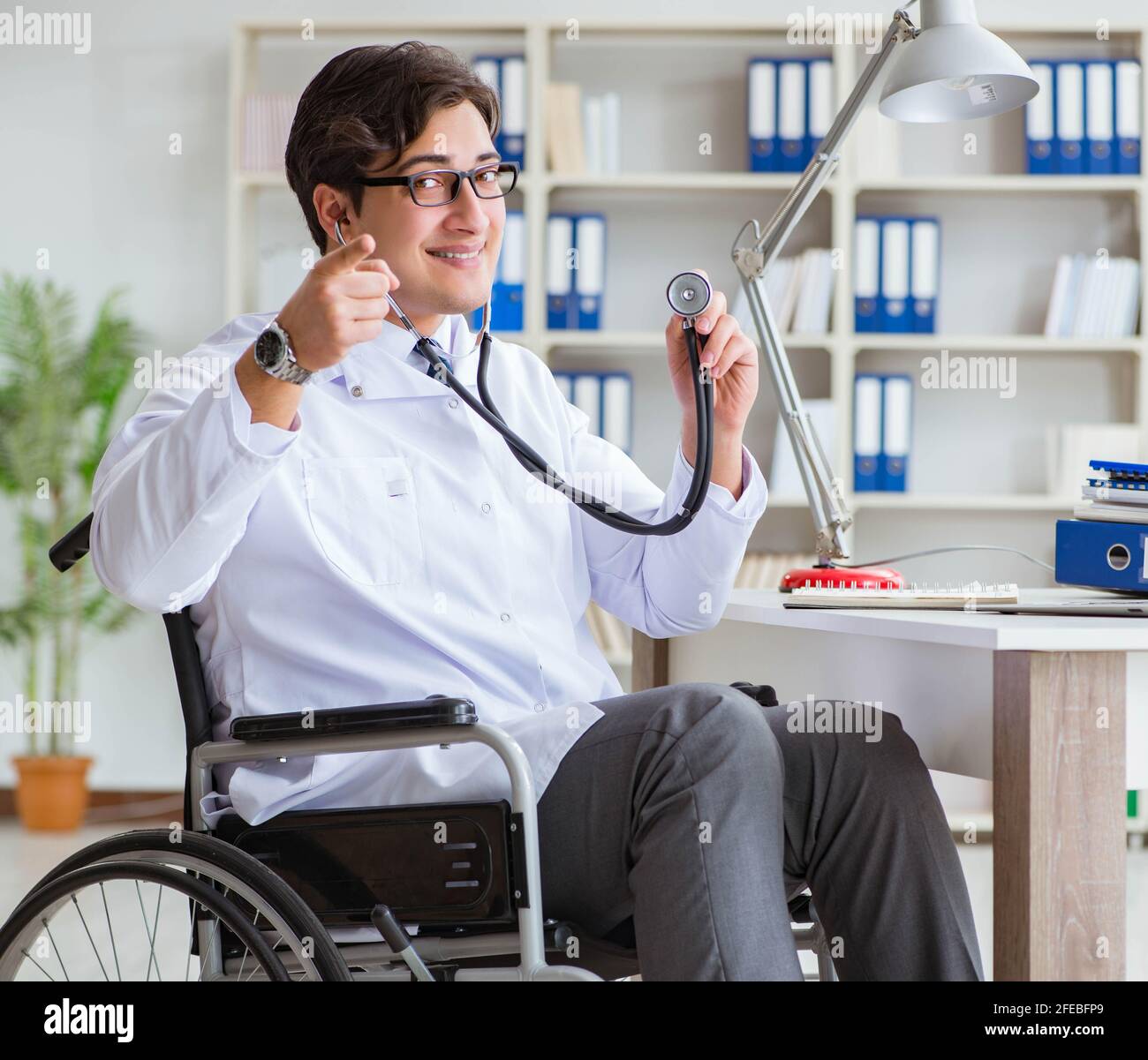 The disabled doctor on wheelchair working in hospital Stock Photo - Alamy
