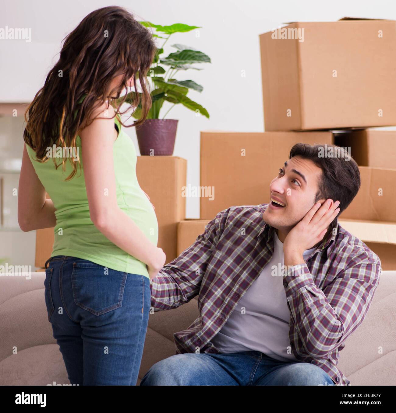 The young couple of man and pregnant wife expecting baby Stock Photo ...