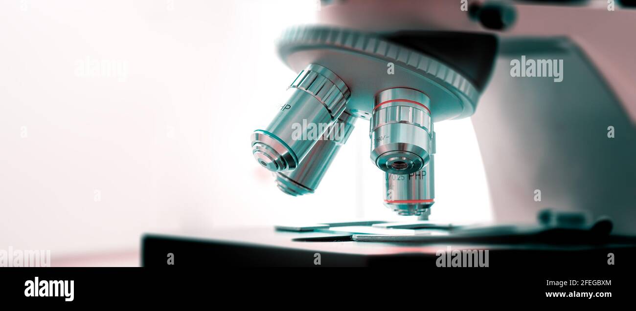 Scientific microscope lenses close up, wide frame with space for text ...