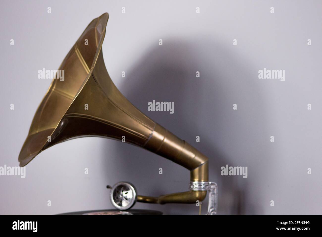 Old gramophone with a plate record. Portable wind-up gramophone ...