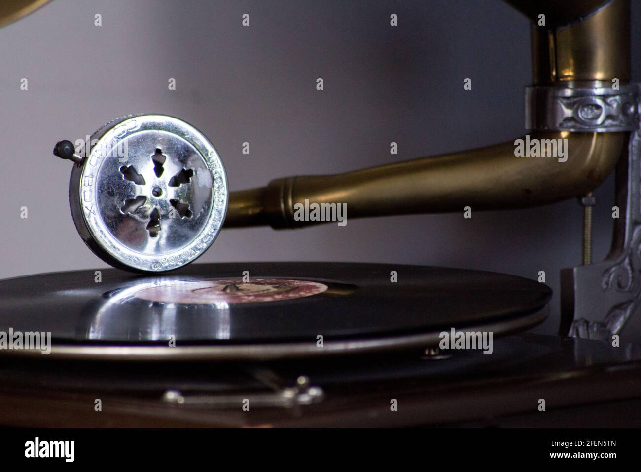 Old gramophone with a plate record. Portable wind-up gramophone ...