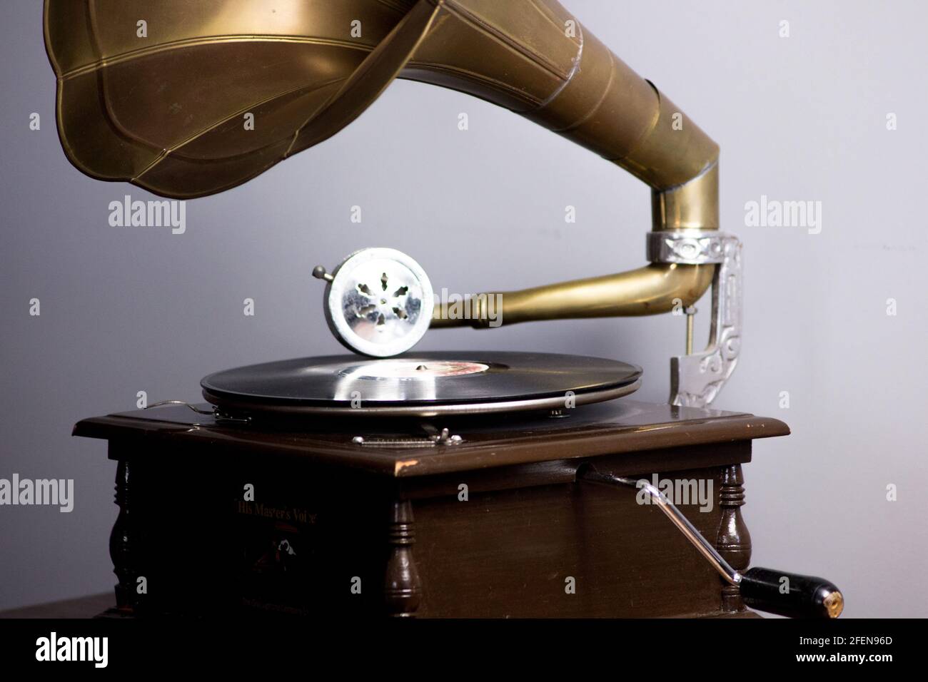 Old gramophone with a plate record. Portable wind-up gramophone ...