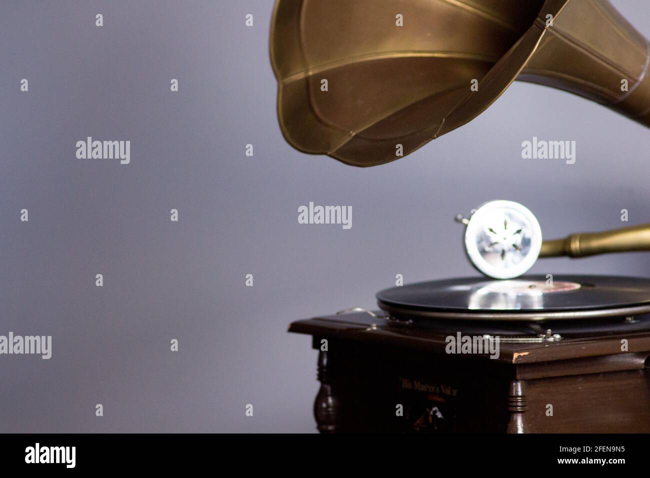 Old gramophone with a plate record. Portable wind-up gramophone ...