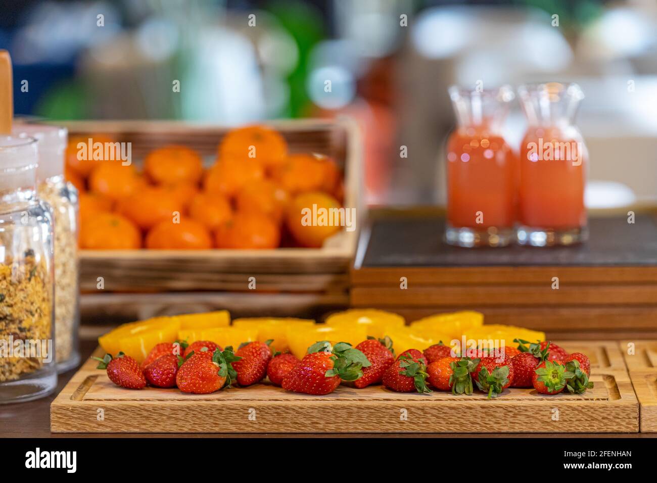 Breakfast buffet served with orange juice, croissants cereal and ...