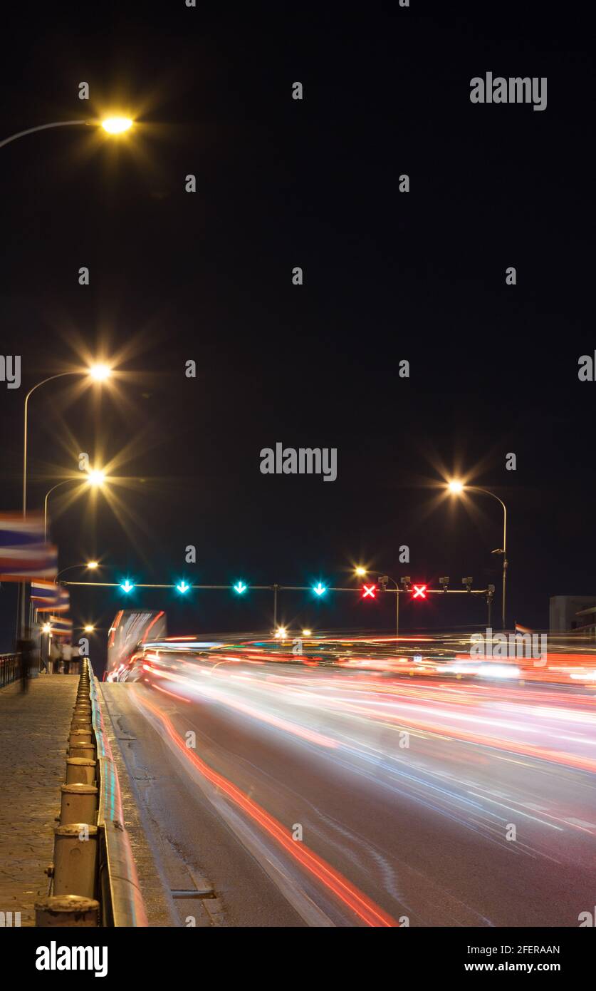 Traffic lights of cars Car traffic on the bridge at night Stock Photo ...
