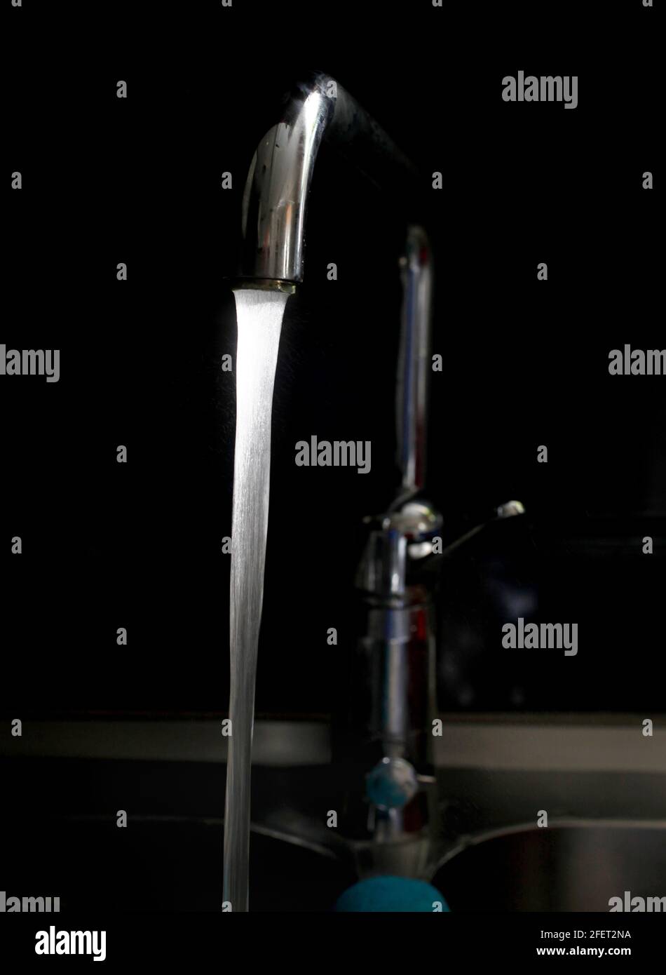Running water from a faucet in a kitchen Stock Photo - Alamy