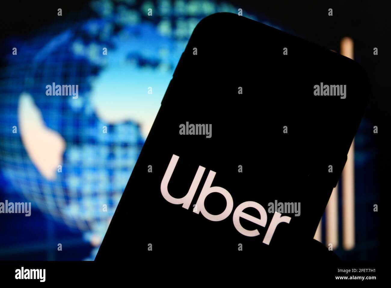 In this photo illustration an Uber company app logo seen displayed on a ...