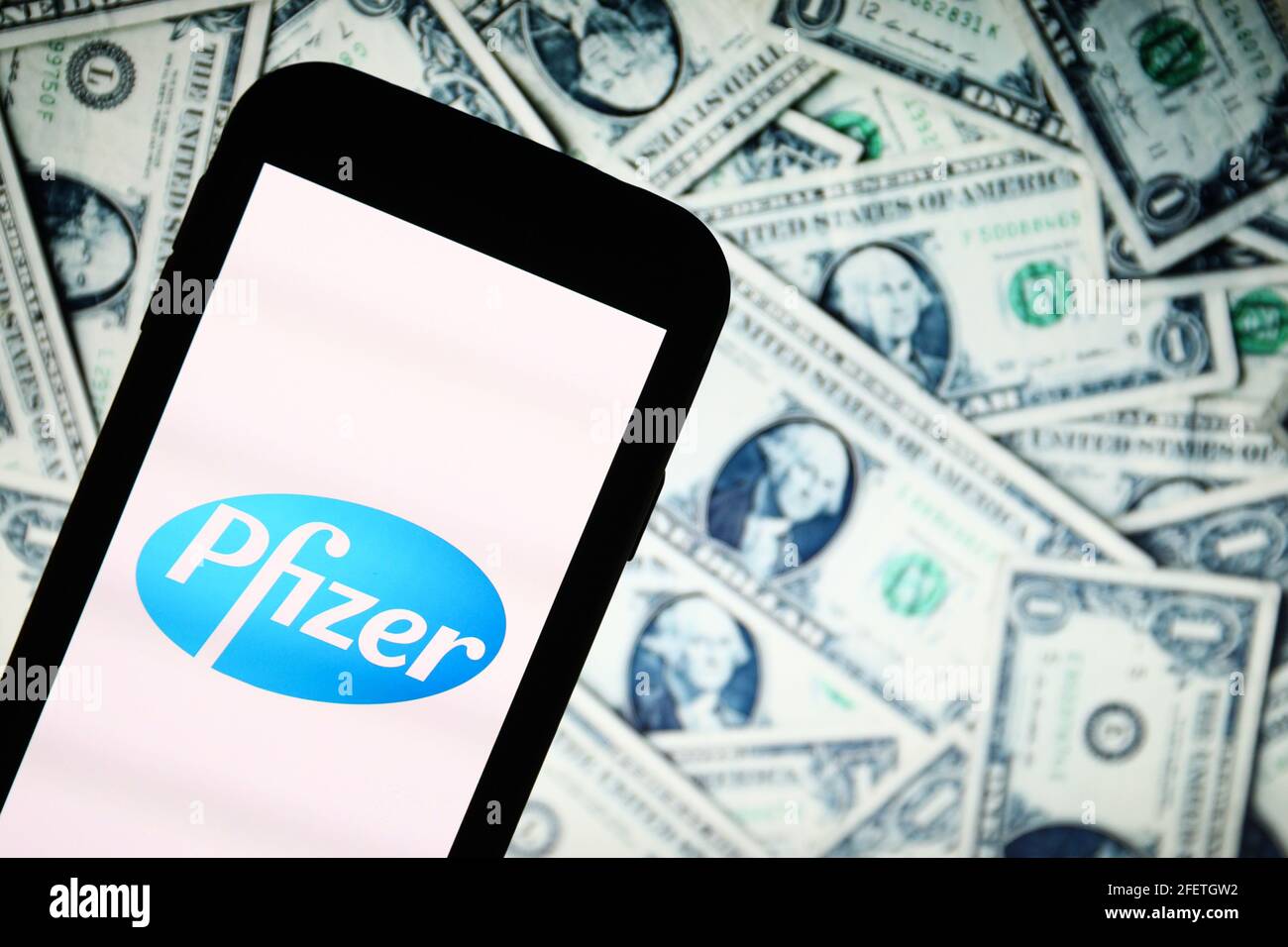 In this photo illustration a Pfizer pharmaceutical company app logo ...