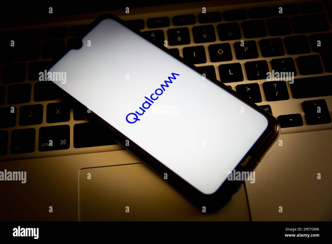 In this photo illustration, a Qualcomm logo seen displayed on a ...