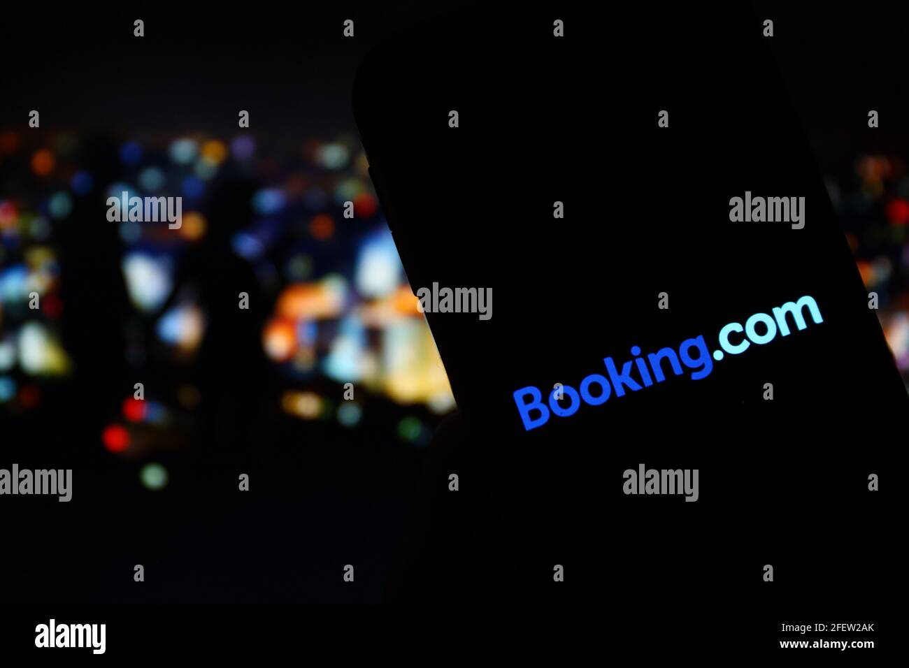 In this photo illustration a Booking.com app logo seen displayed on a ...