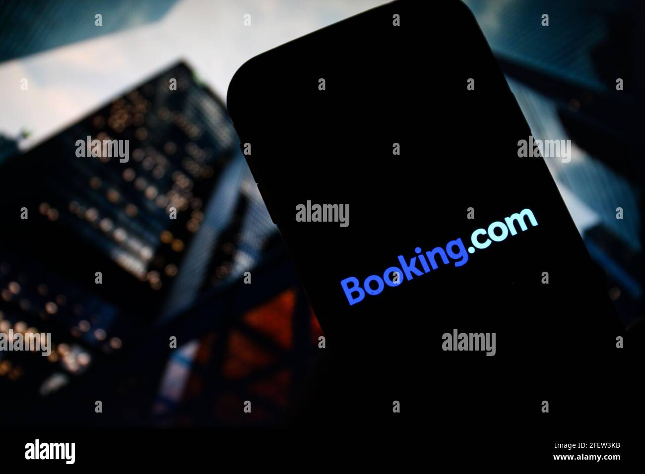In this photo illustration a Booking.com app logo seen displayed on a ...