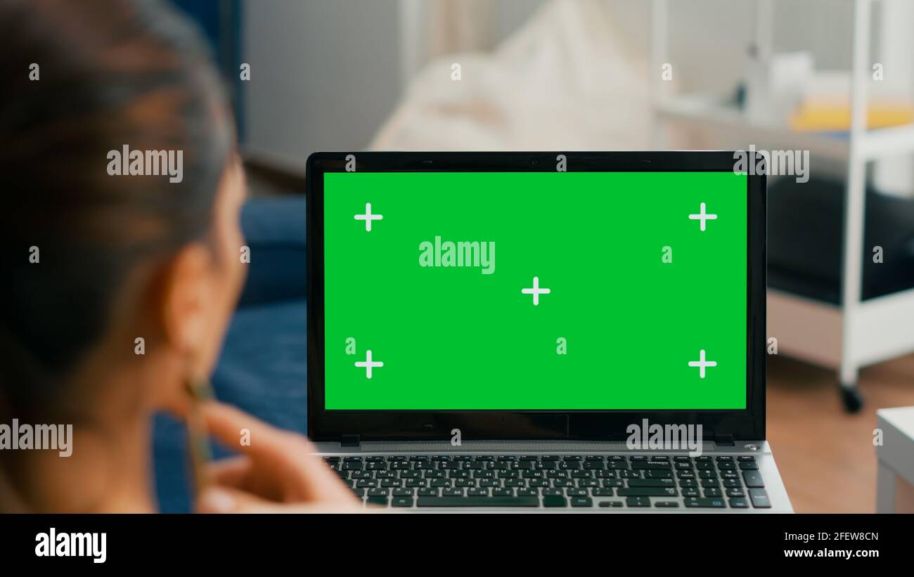 Close up of laptop computer with mock up green screen chroma key ...