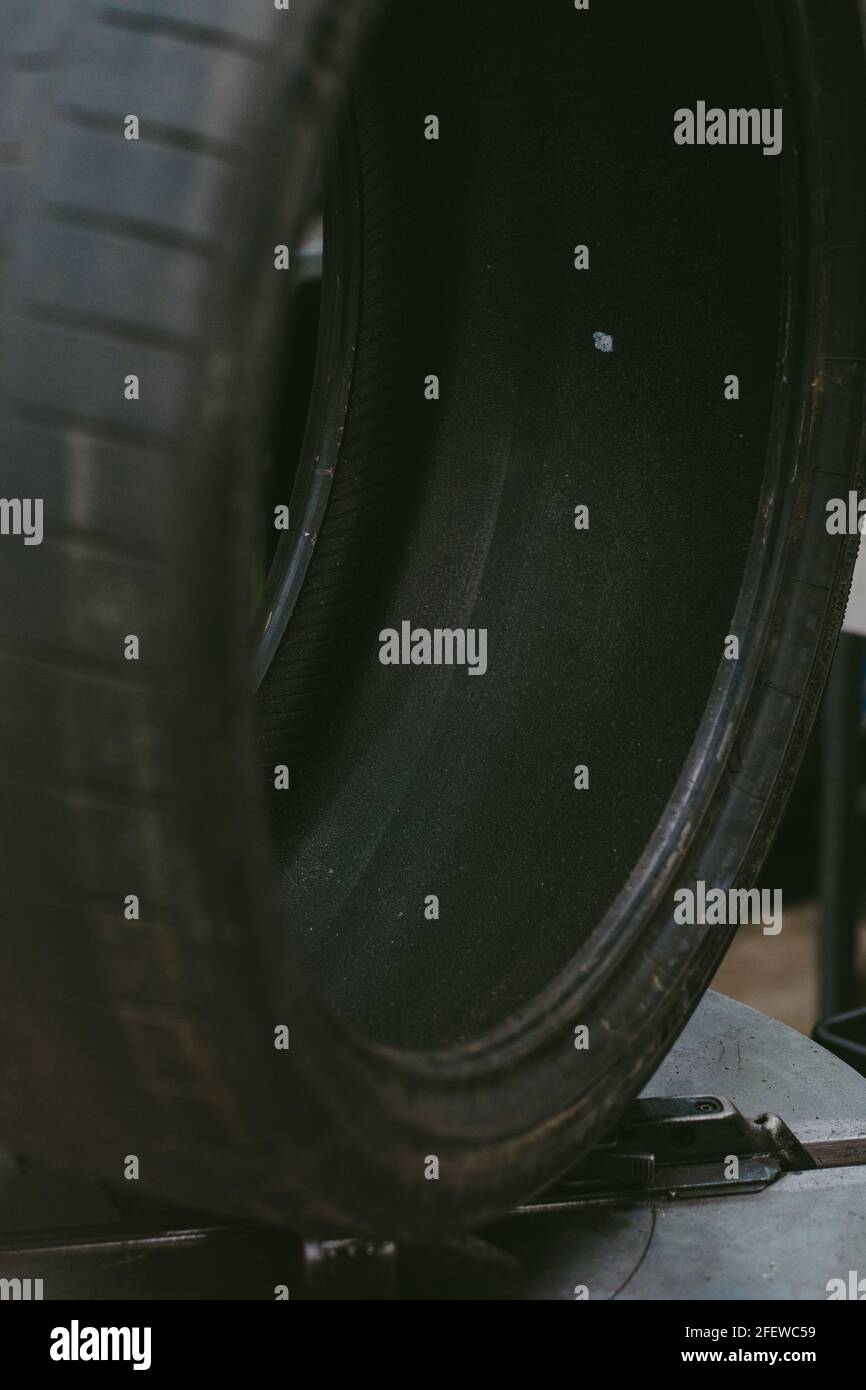 Vertical shot of a car tire without the rim in a workshop Stock Photo ...