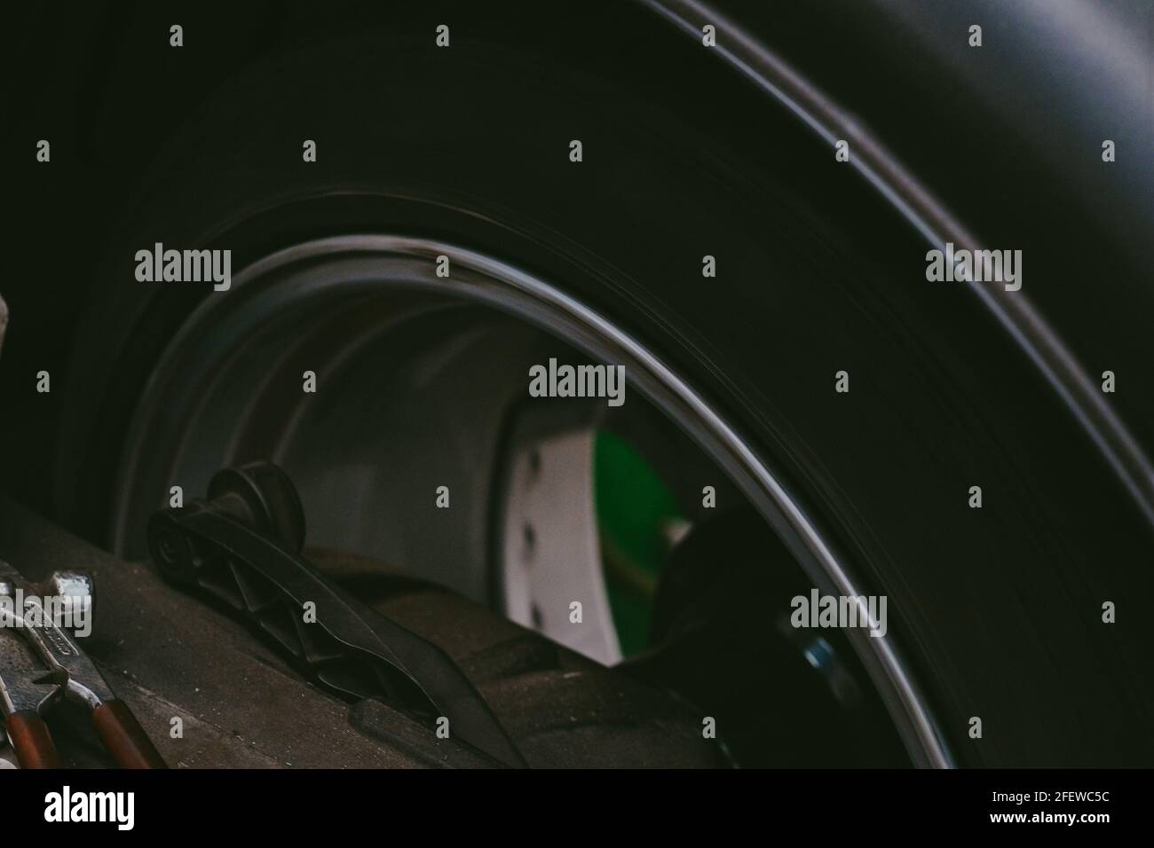 Car tire in a workshop with its rim removed Stock Photo - Alamy