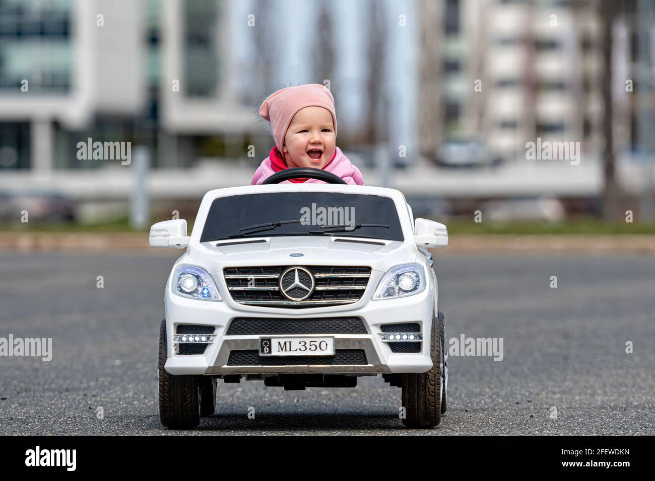 little girldriving a toy car. little driver, childrens car, concept of ...