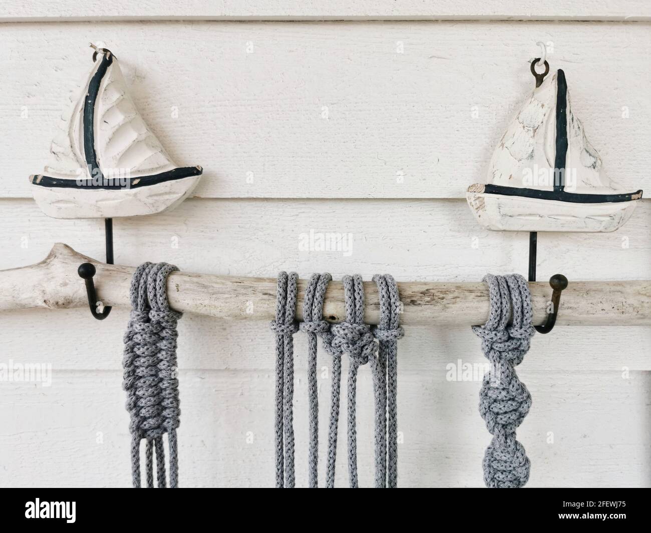 Crochet from grey cotton yarn wall hanging with two boats sculptures on ...