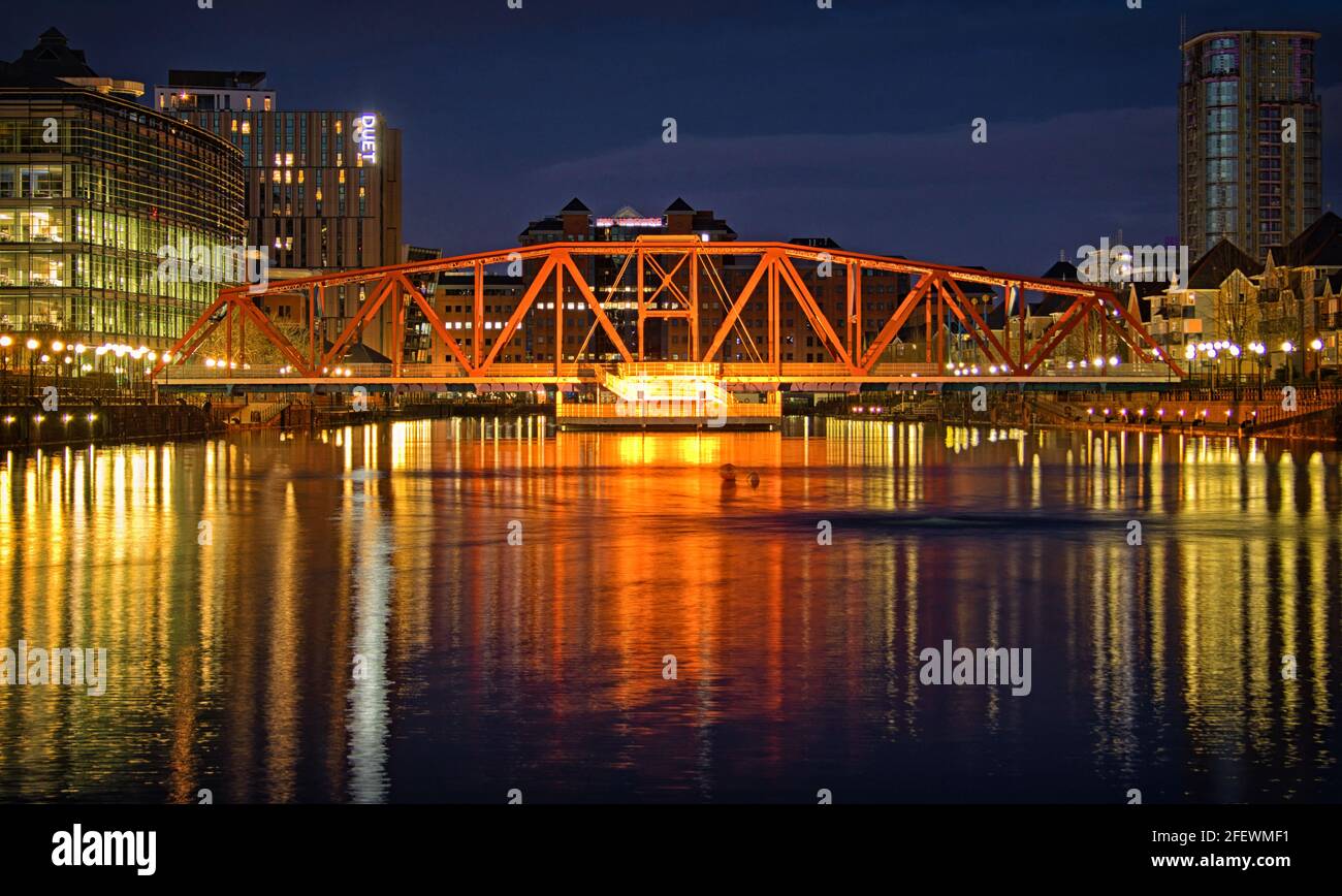 The historic rotating bridge at Salford Quays, seen at night Stock ...