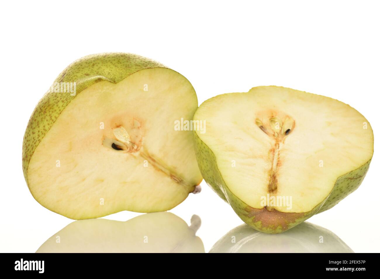 Two half, in focus, sweet pears on a white background Stock Photo - Alamy