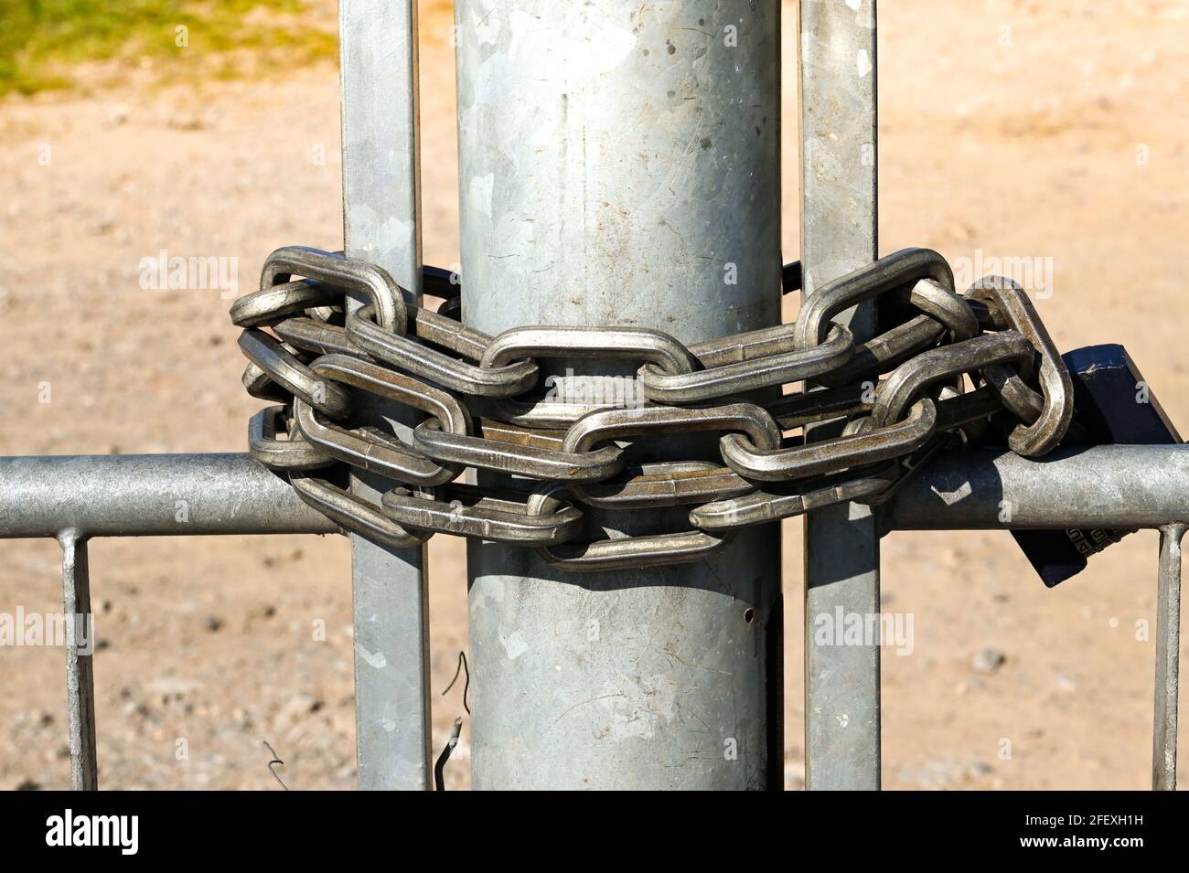 Heavy metal chain and lock around a gate and gatepost. No people Stock ...